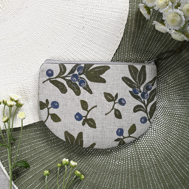 Handmade linen beauty pouch with blueberries pattern.